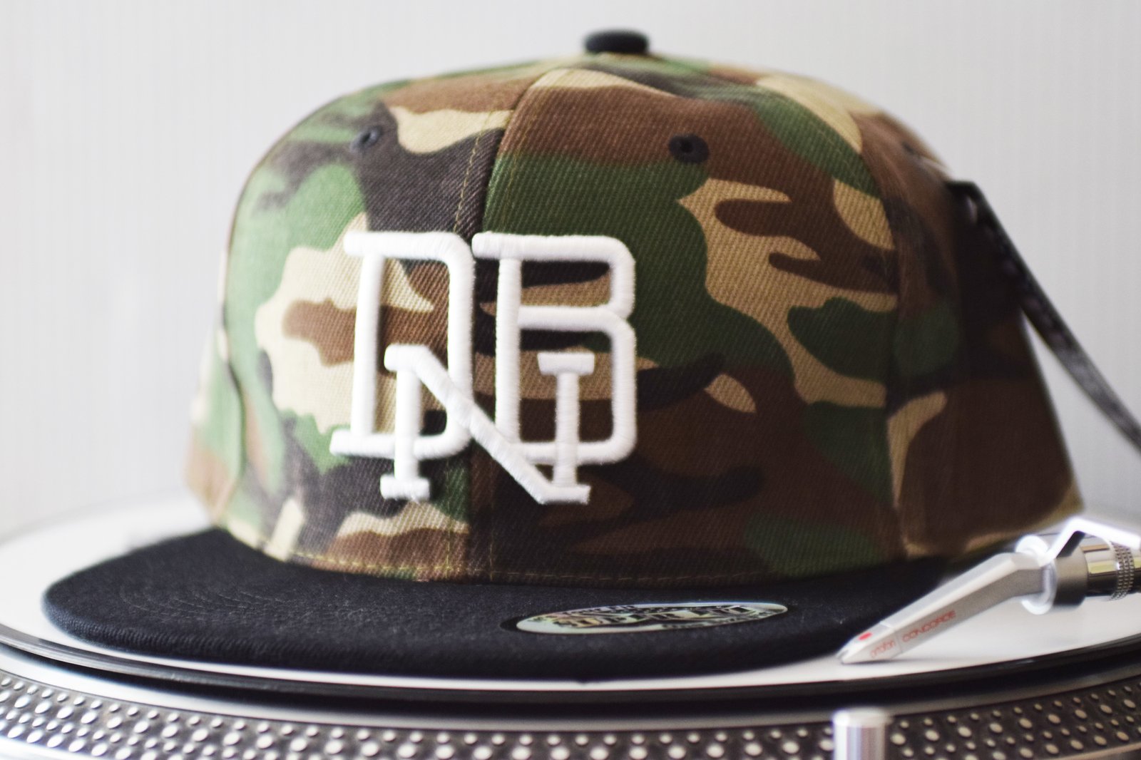 DRUM & BASS SNAPBACK HAT "DNB"- CAMO/BLACK / Junglist Supply Co
