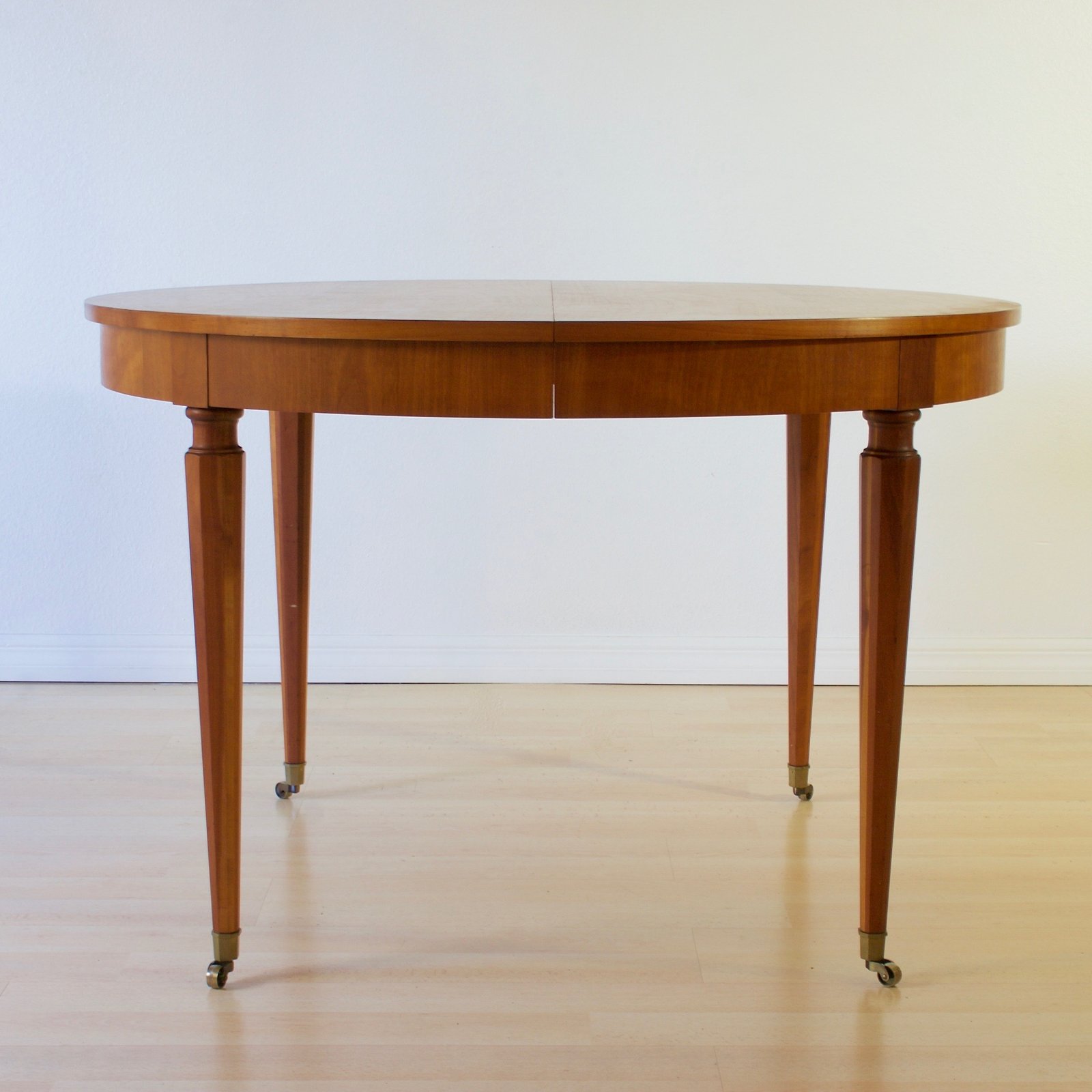 Round Dining Table : Cherry Wood + Brass Casters / Dominique Provost
