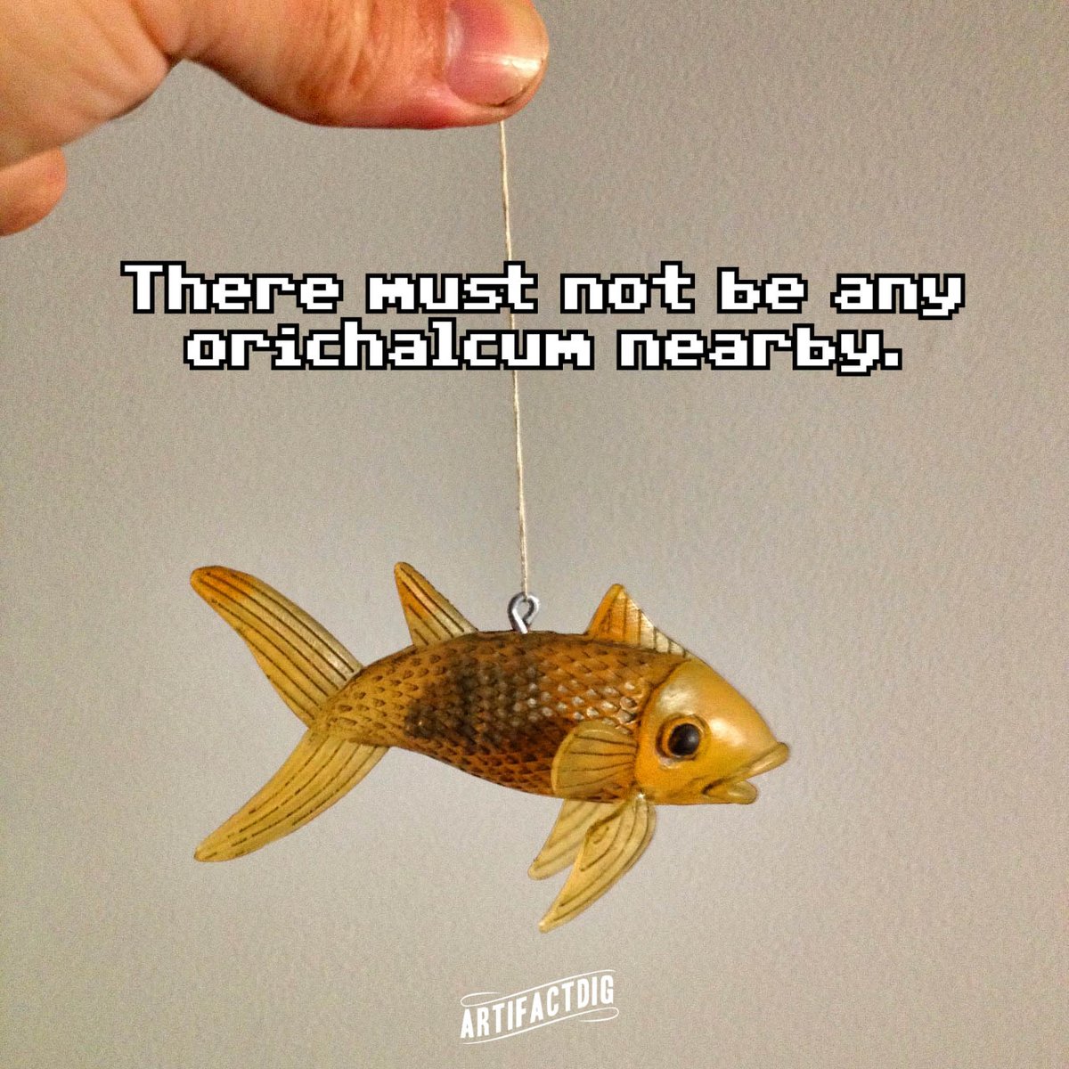 Amber Fish on a string | artifactdig