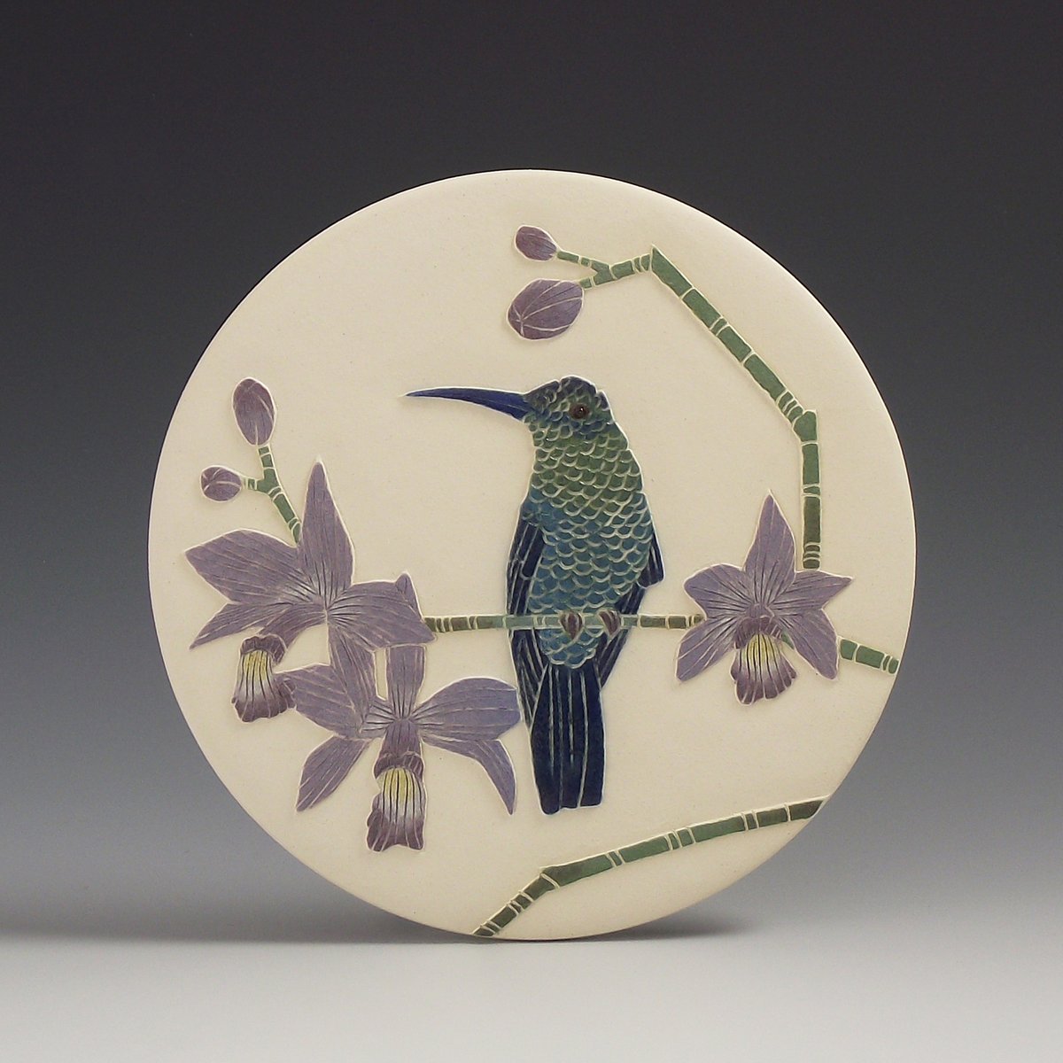 Tiffany Scull ceramics — Violet capped hummingbird carved wall hanging