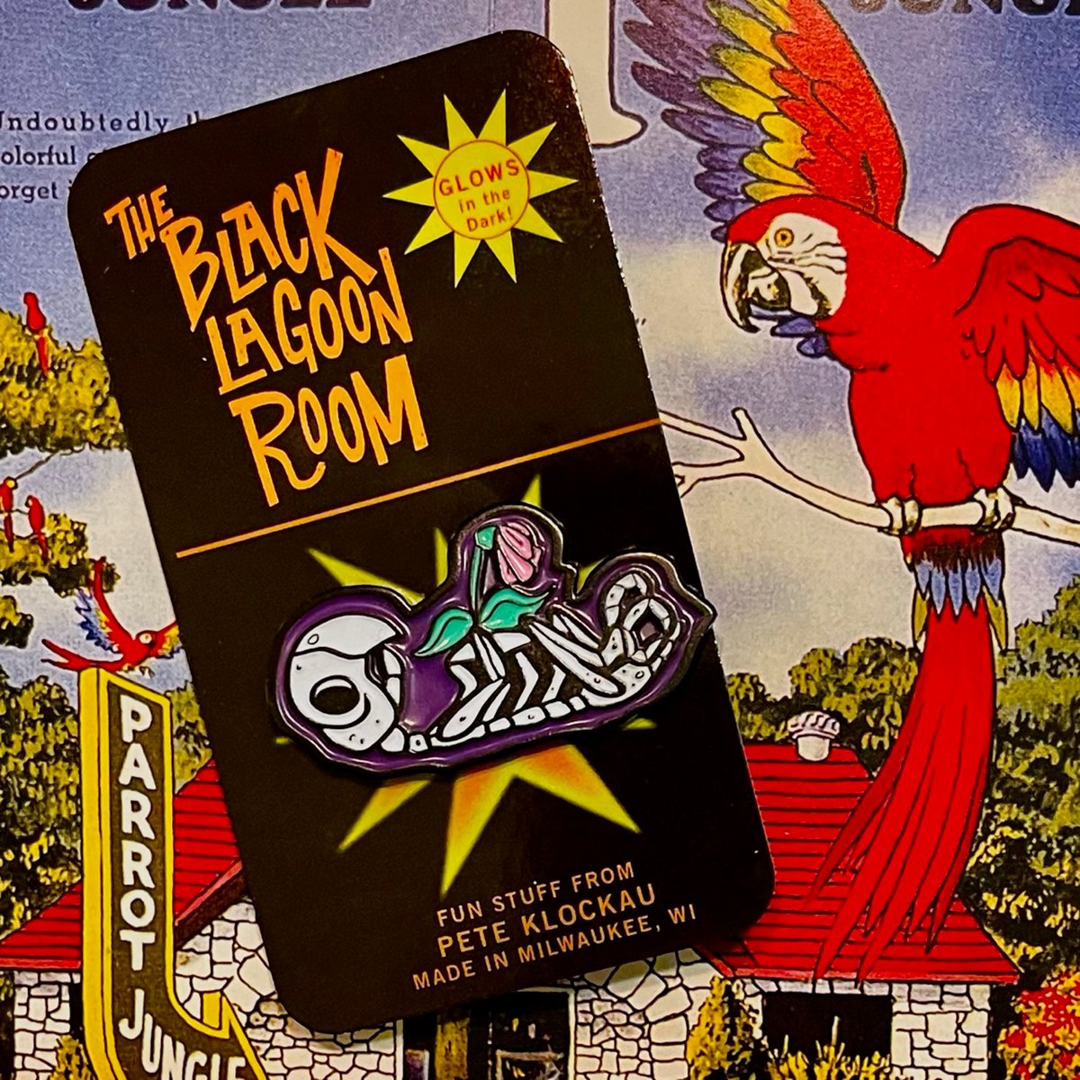 An EX-PARROT Glow-in-the-Dark 1.75" Enamel Pin | The Black Lagoon Room
