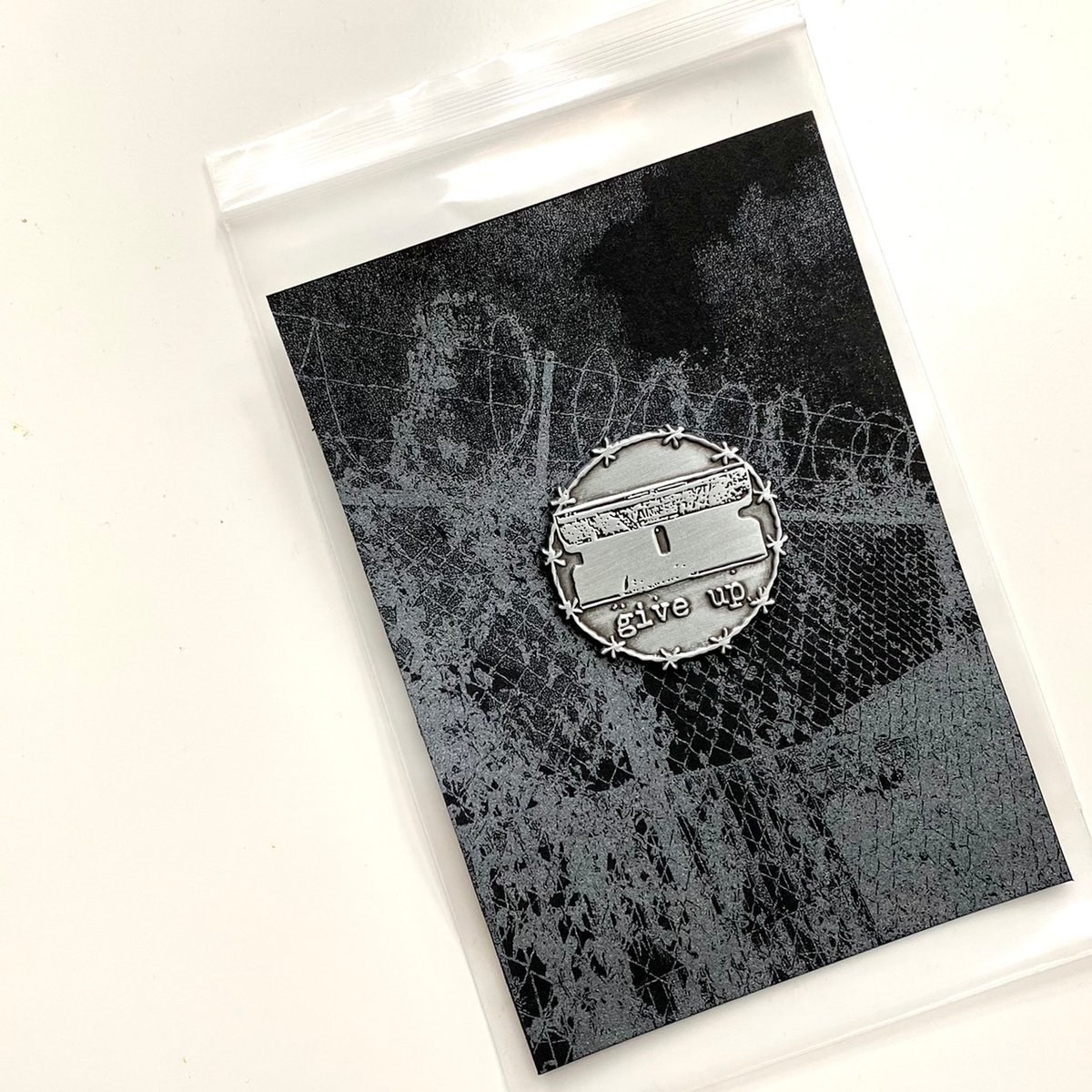 barbed razor pin / give up