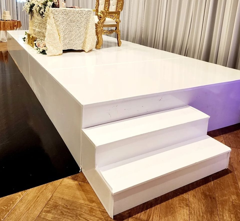 Kunakeys Luxury Decor & Party Rentals — Stage wrap white vinyl