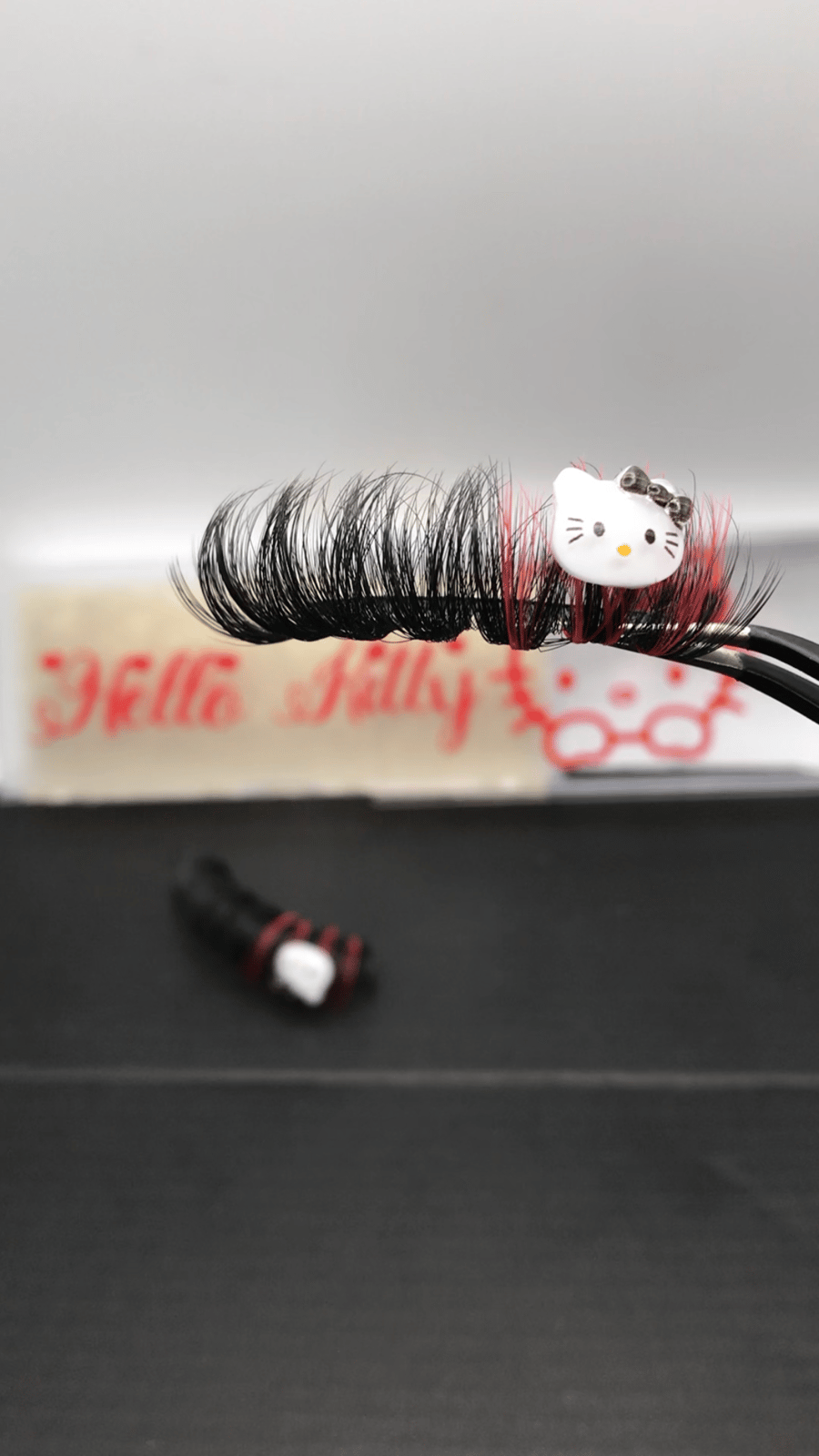 Red with black hello kitty charm lashes | Beauty By $hade