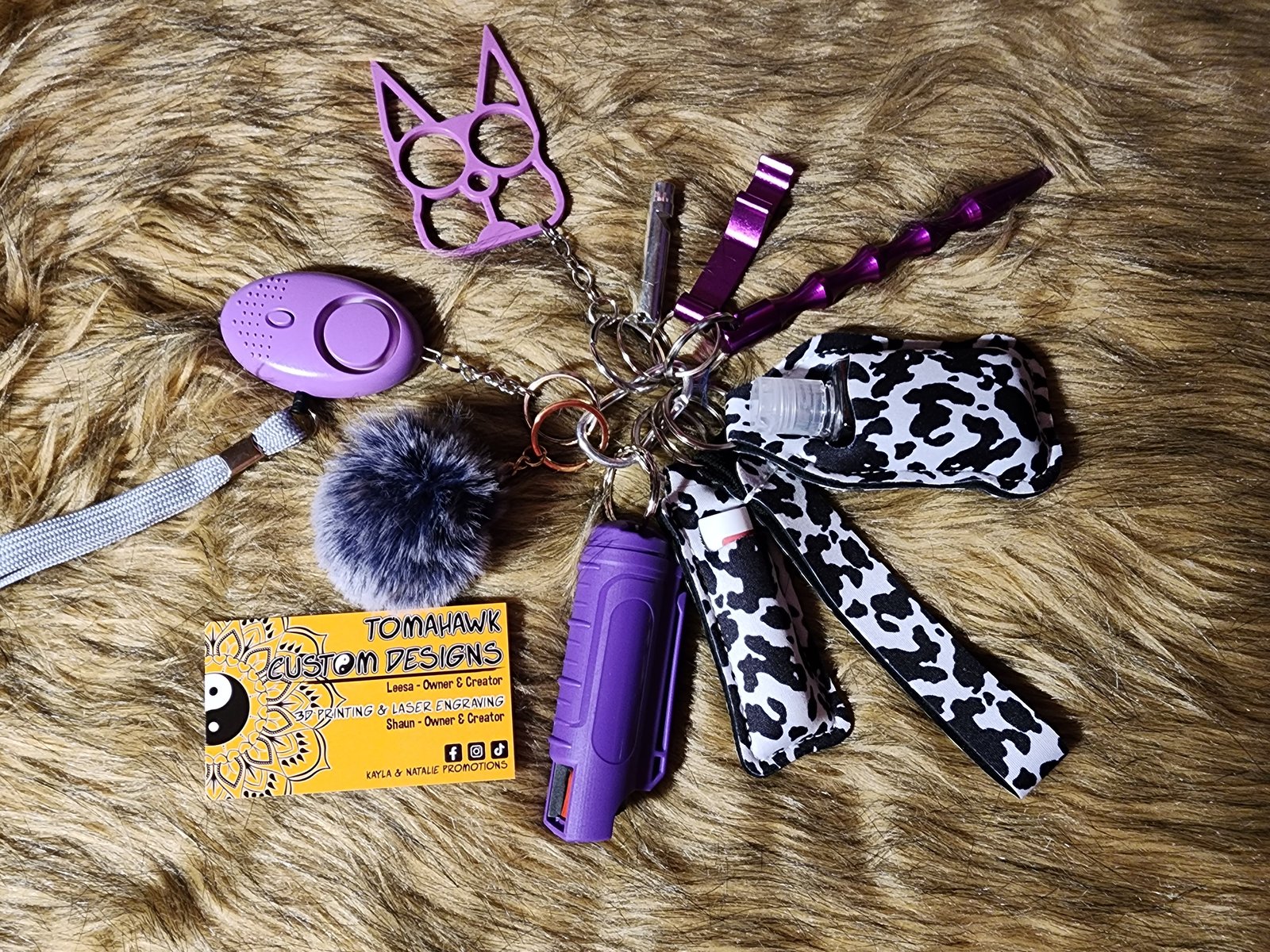 Cow print with purple safety keychain | Tomahawk Custom Designs